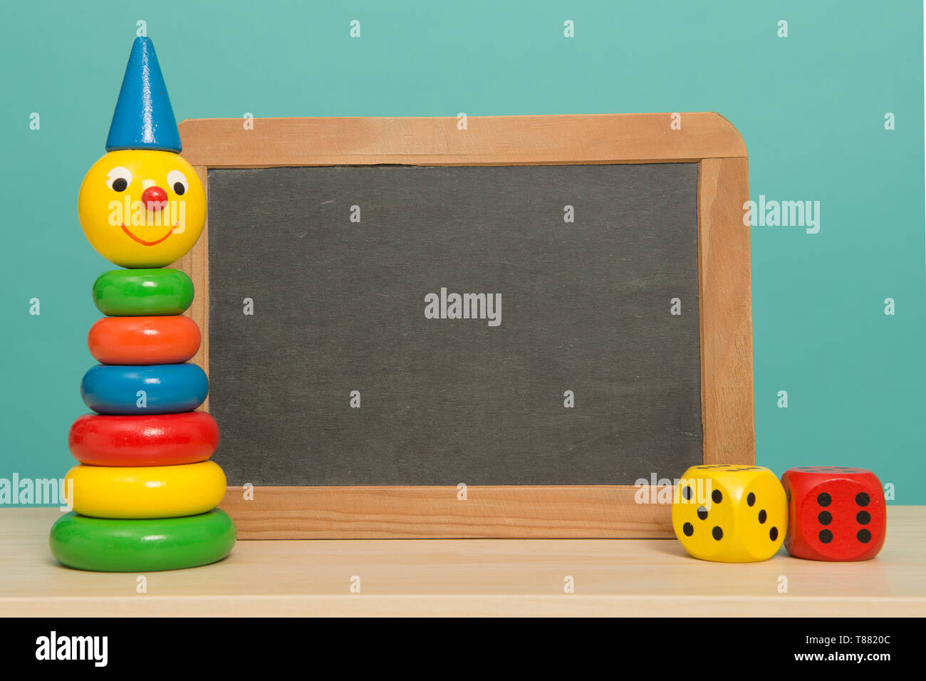 Chalkboard with wooden frame on a blue background with wooden child ...