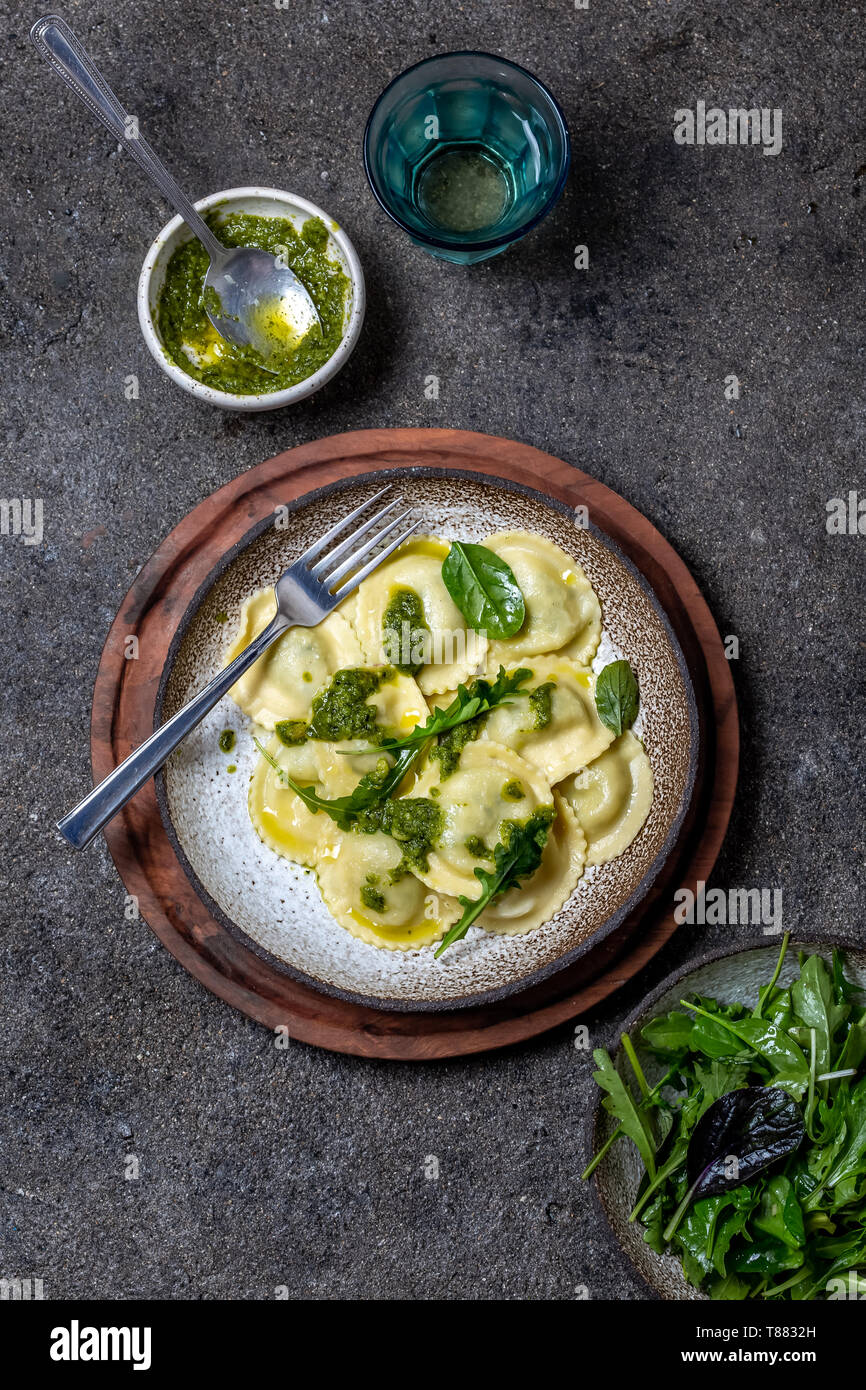 Italian spinach ricotta ravioli, Top view, black background, copy space ...
