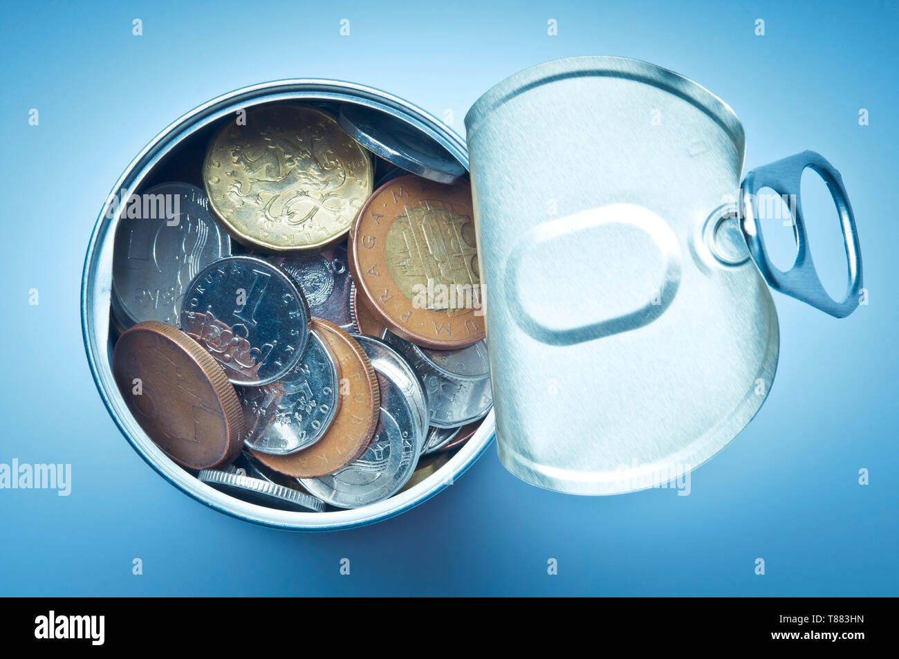 Can filled with coins hi-res stock photography and images - Alamy