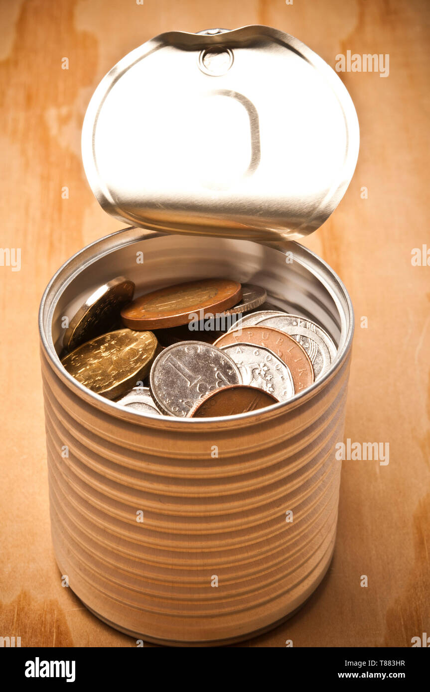Can filled with coins hi-res stock photography and images - Alamy