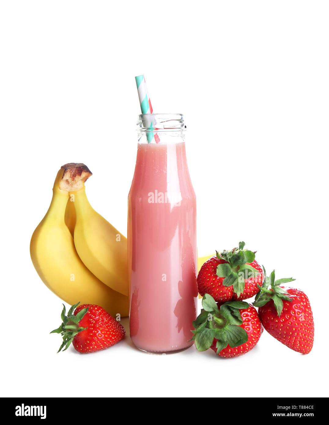 Glass bottle of tasty drink with ingredients on white background Stock ...