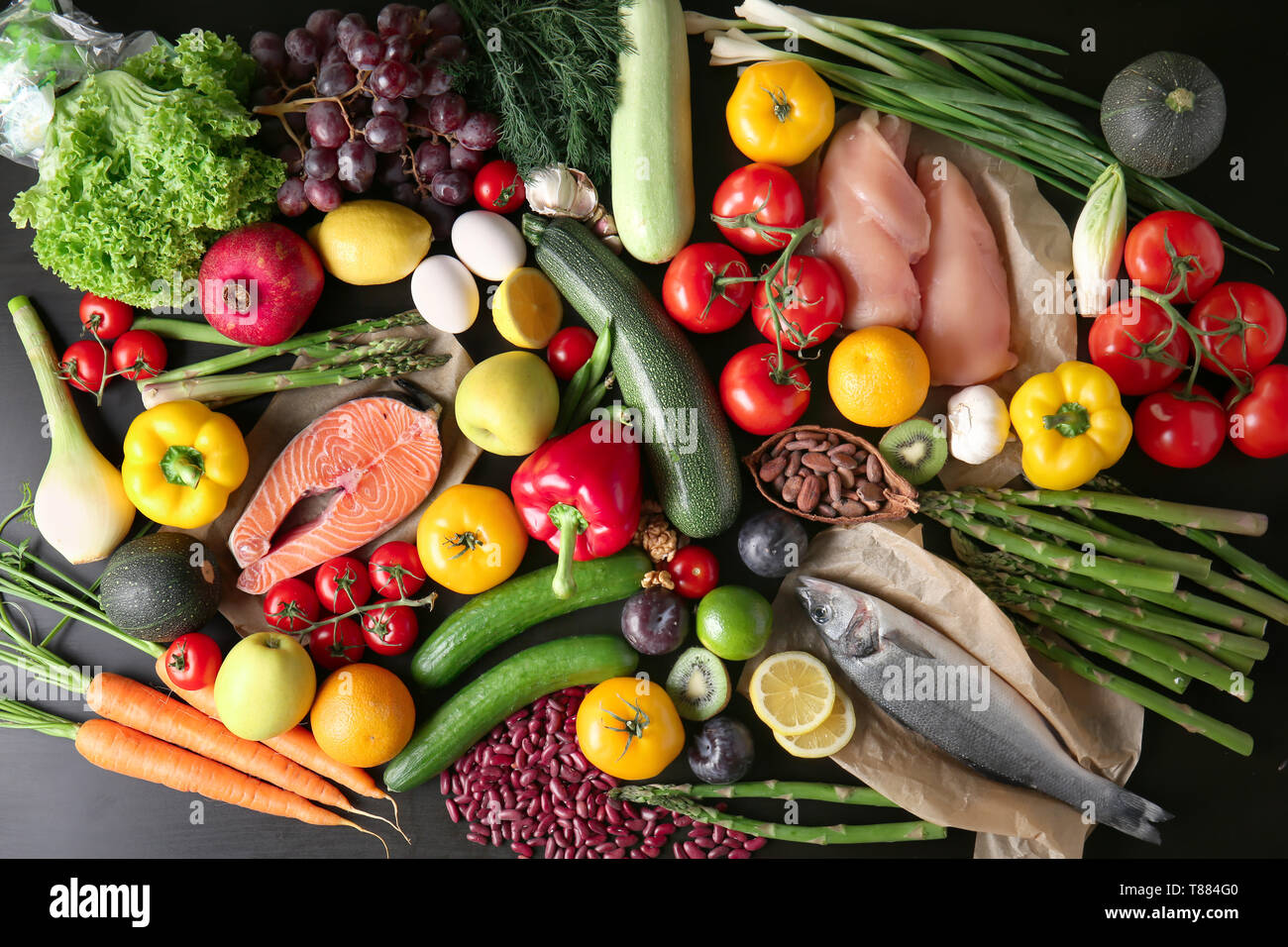 Various healthy products on dark background Stock Photo - Alamy