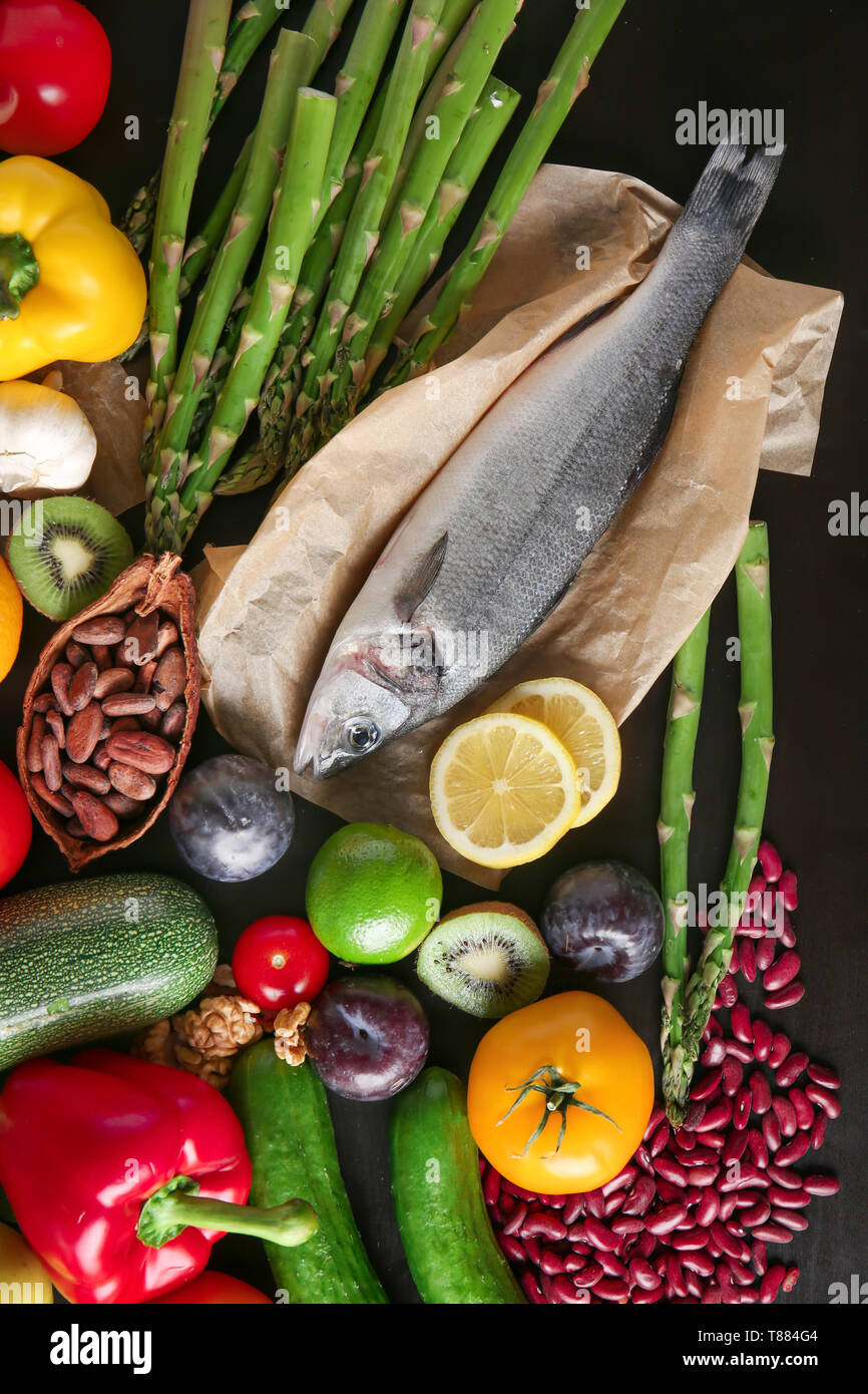 Various healthy products on dark background Stock Photo - Alamy