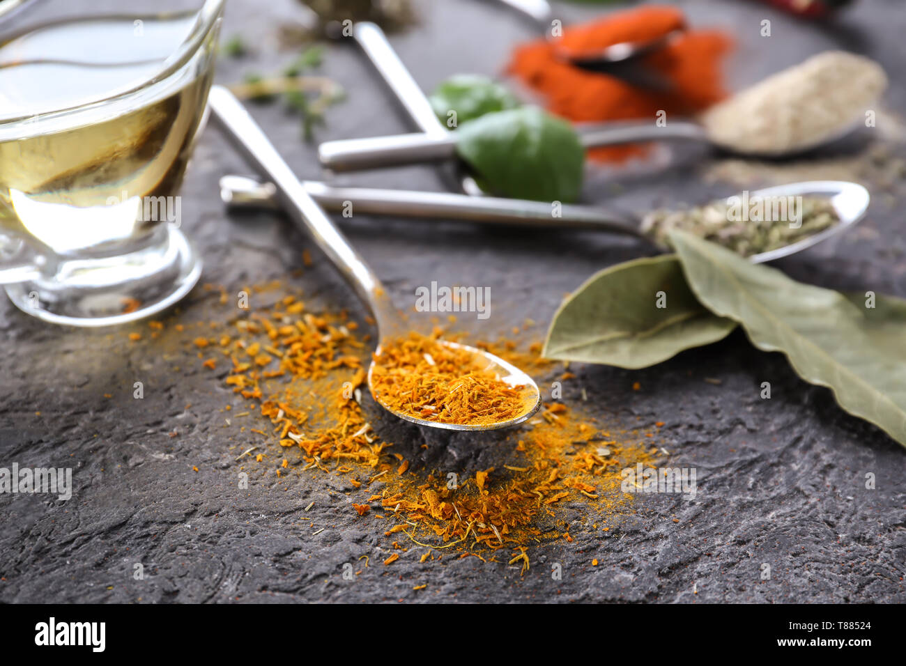 Different kinds of spices on grey background Stock Photo - Alamy