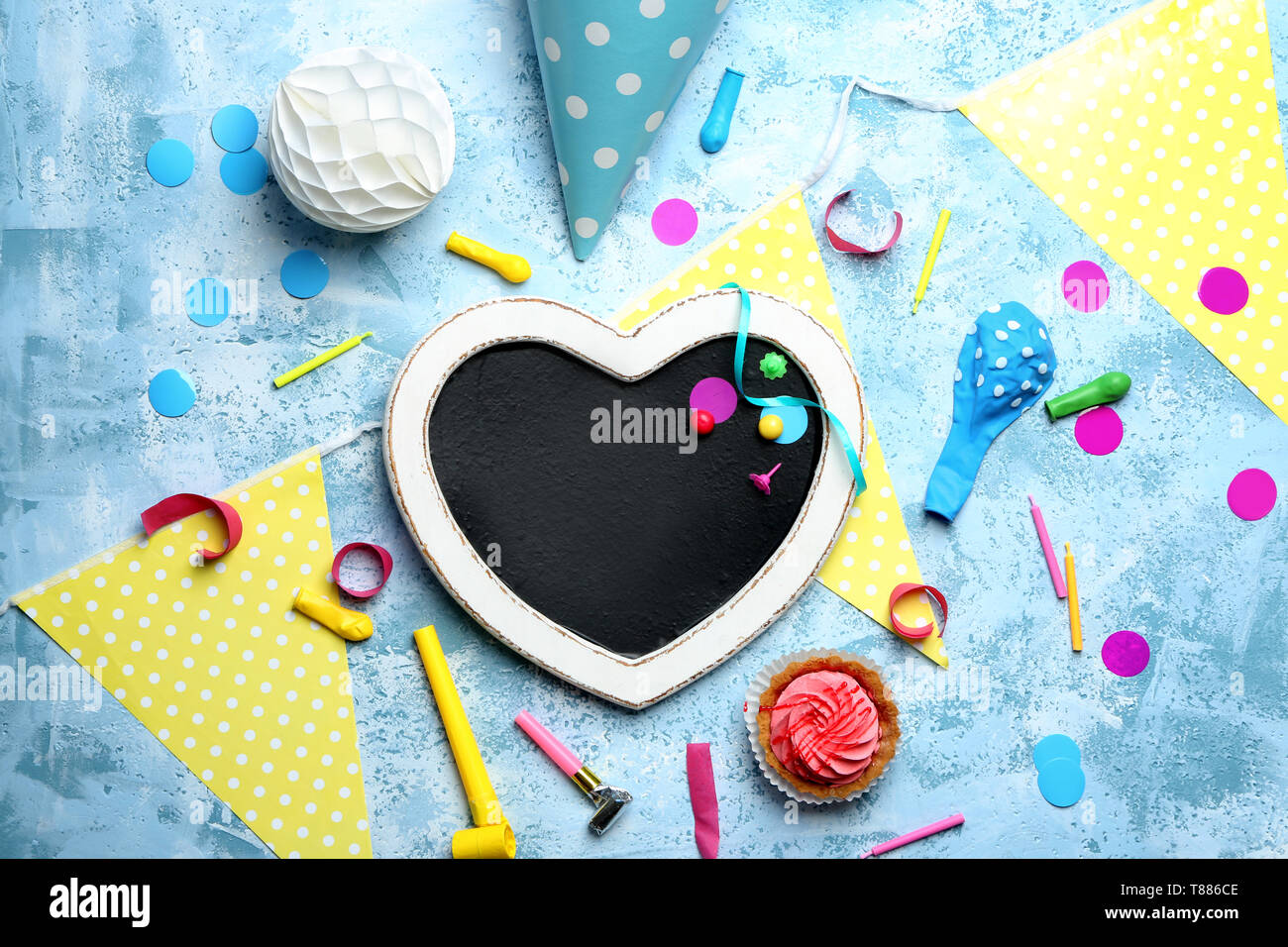 Birthday composition with party items on color background Stock Photo ...