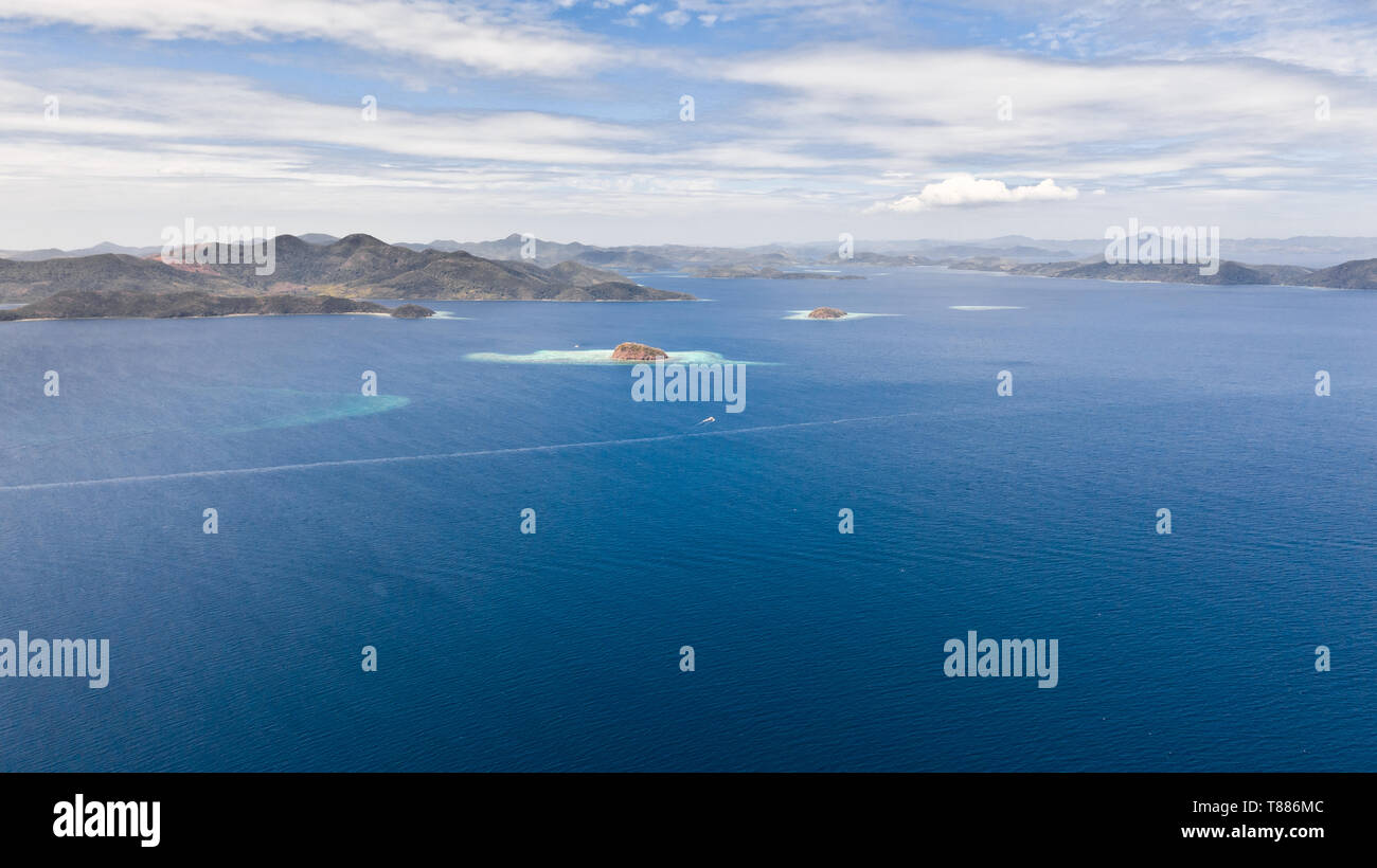 aerial view tropical islands with blue lagoon, coral reef and sandy ...