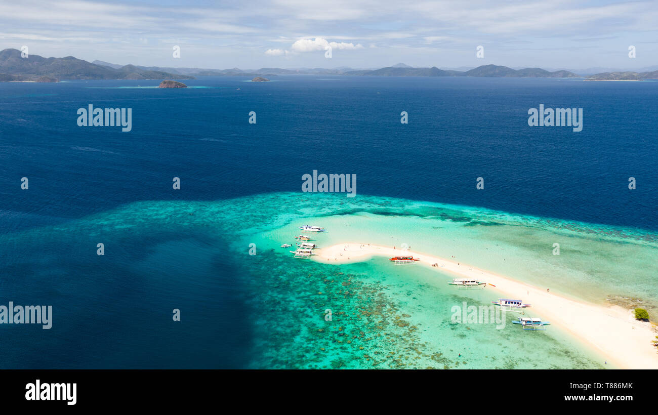 aerial seascape tropical island with sand bar, turquoise water and ...