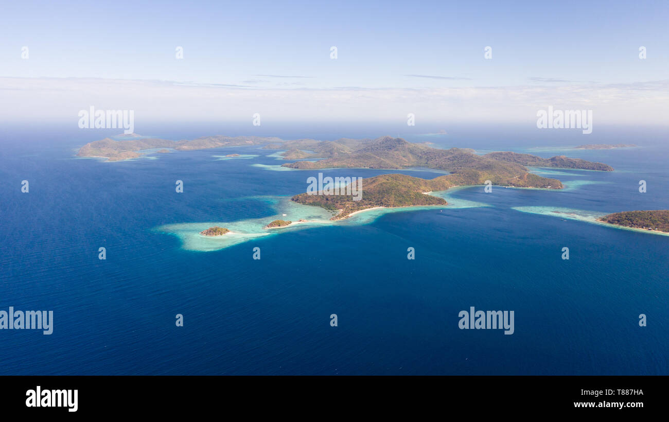 aerial view tropical islands with blue lagoon, coral reef and sandy ...