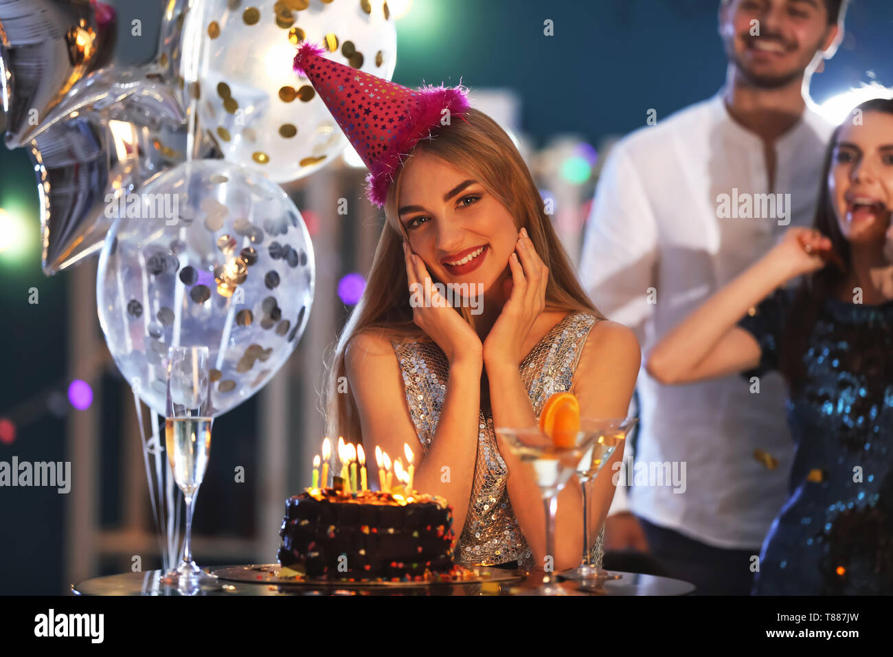 Woman near birthday party cake hi-res stock photography and images - Alamy