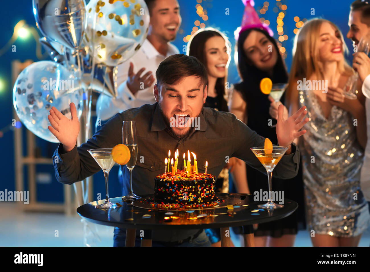 Woman near birthday party cake hi-res stock photography and images - Alamy