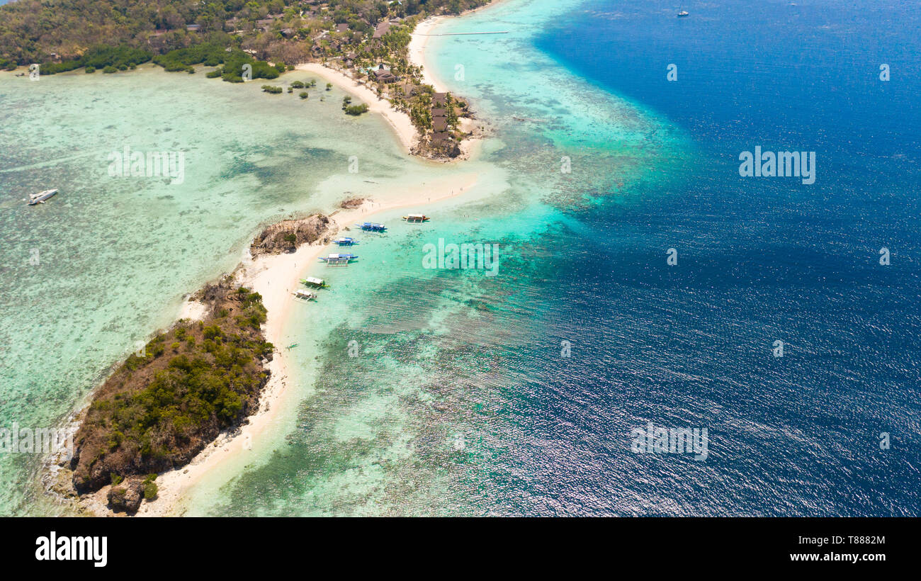 Tropical islands with white beaches. Turquoise lagoon and coral reefs ...