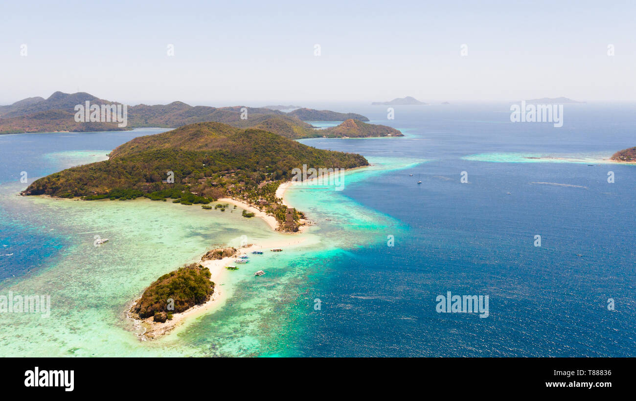 Tropical islands with white beaches. Turquoise lagoon and coral reefs ...