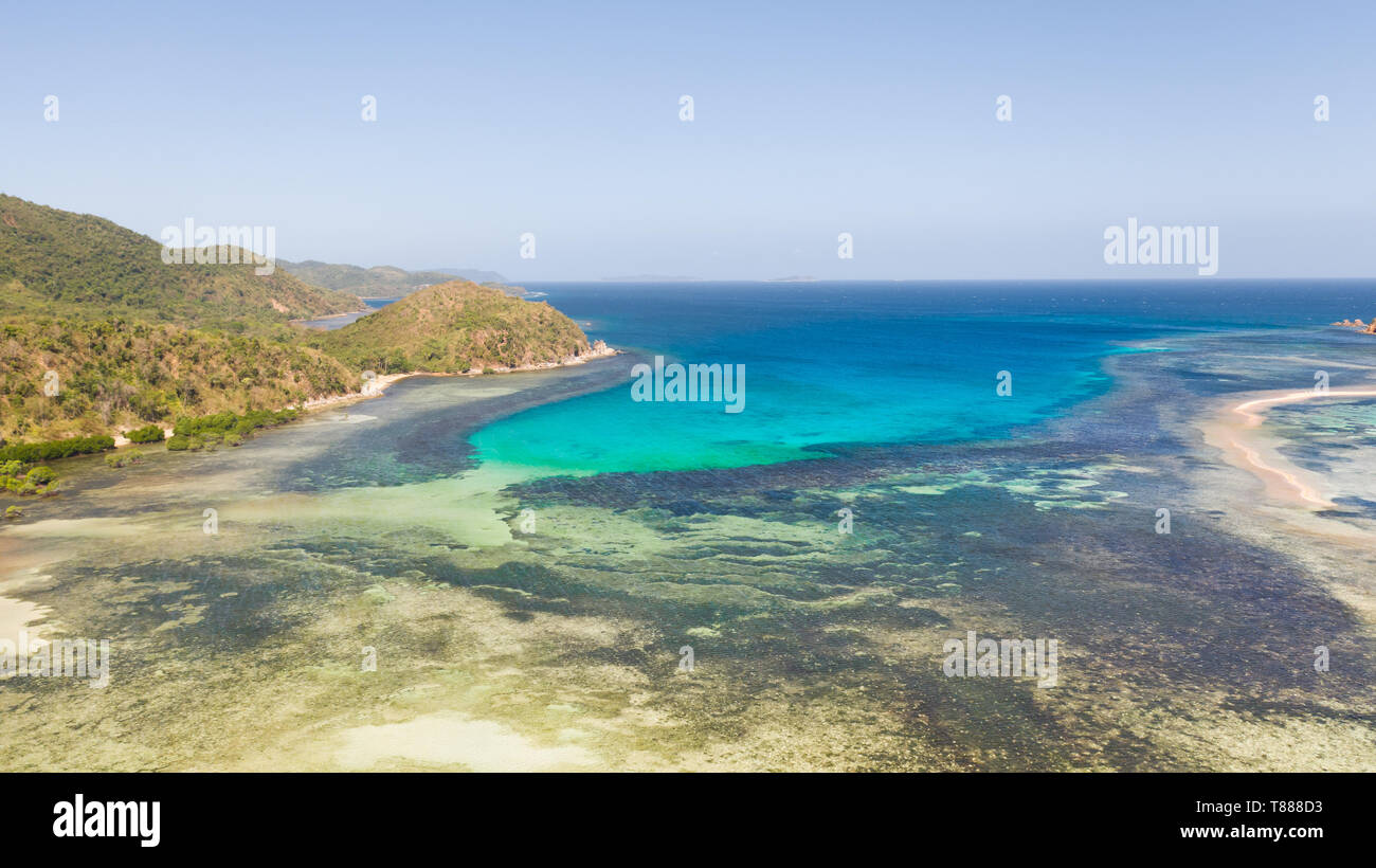 SmSmall islands with a sand bar. Coral reefs and blue lagoons. islands ...
