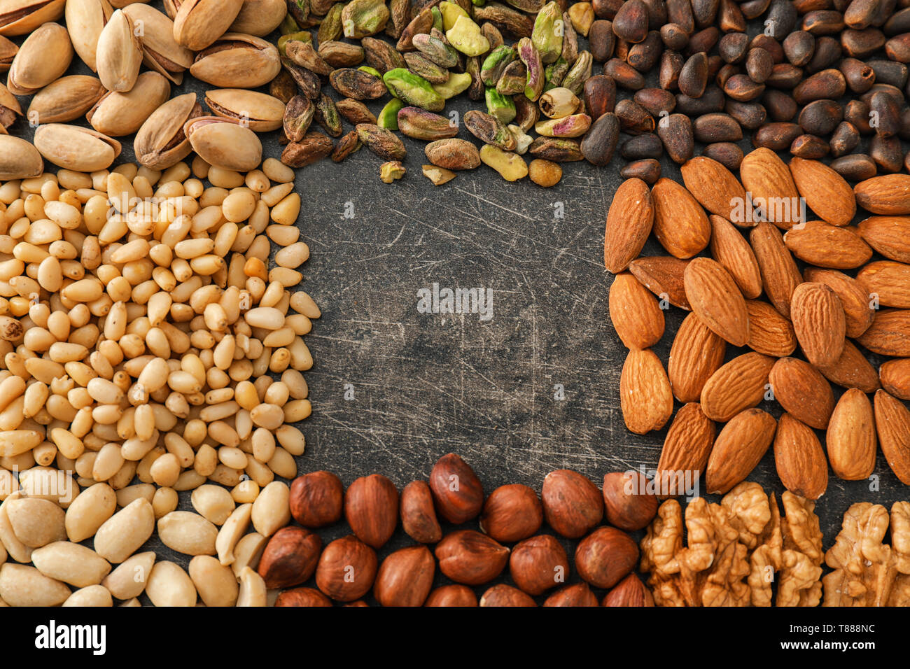 Frame made of different nuts on grey background Stock Photo - Alamy