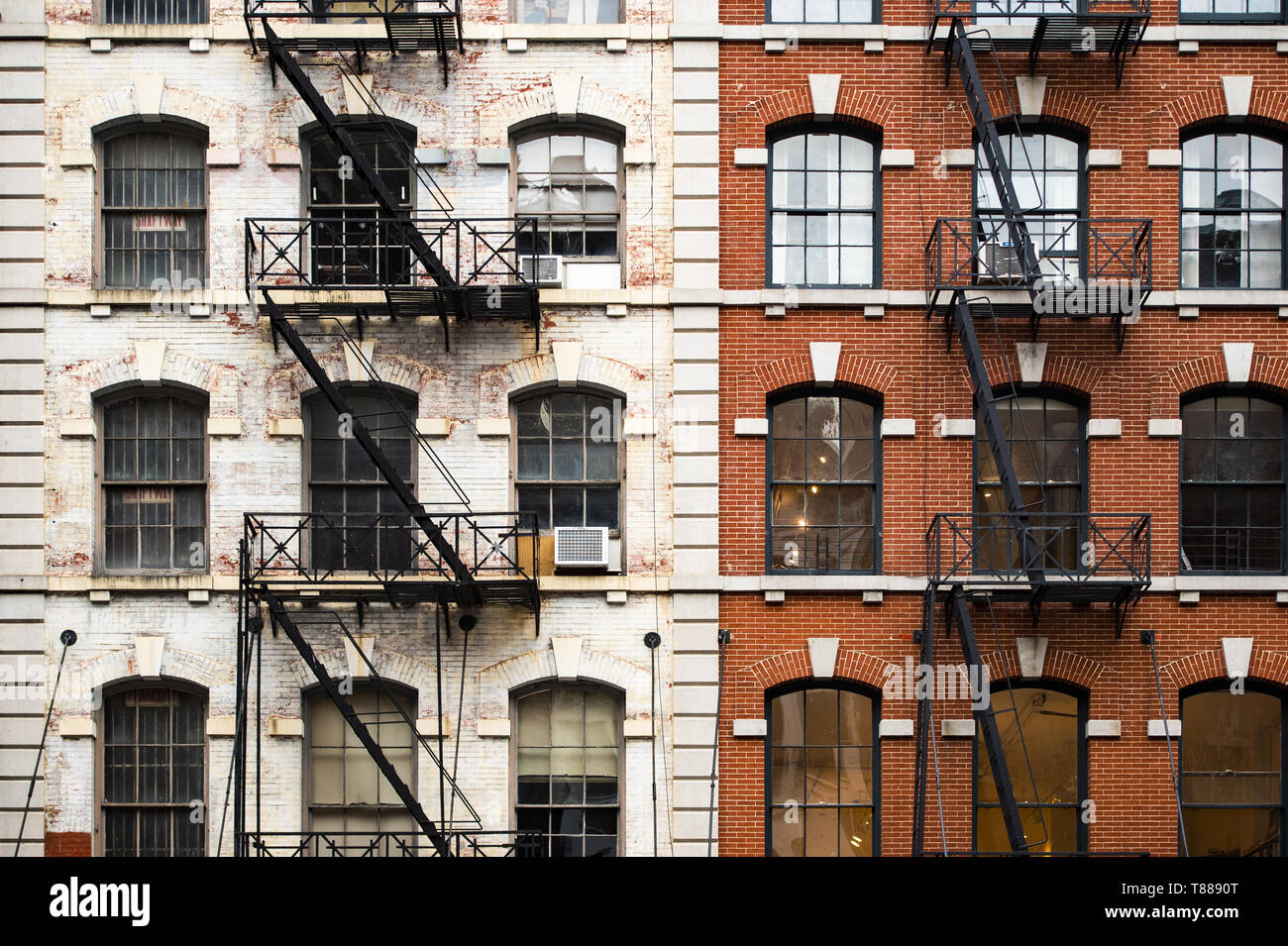 Close-up view of New York City style apartment buildings with emergency ...
