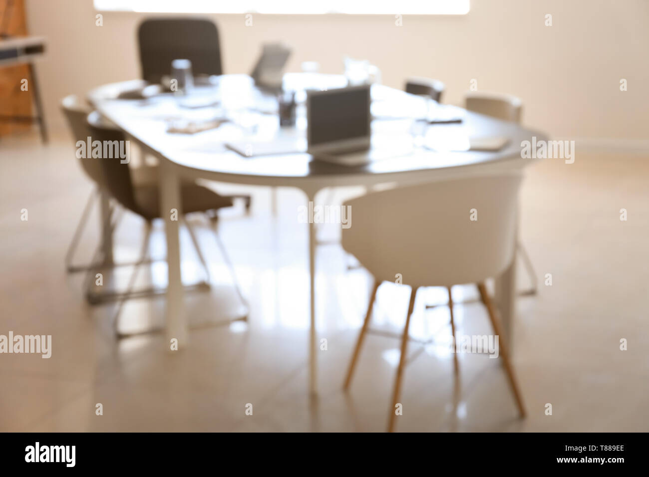 Table prepared for business meeting in conference hall, blurred view ...