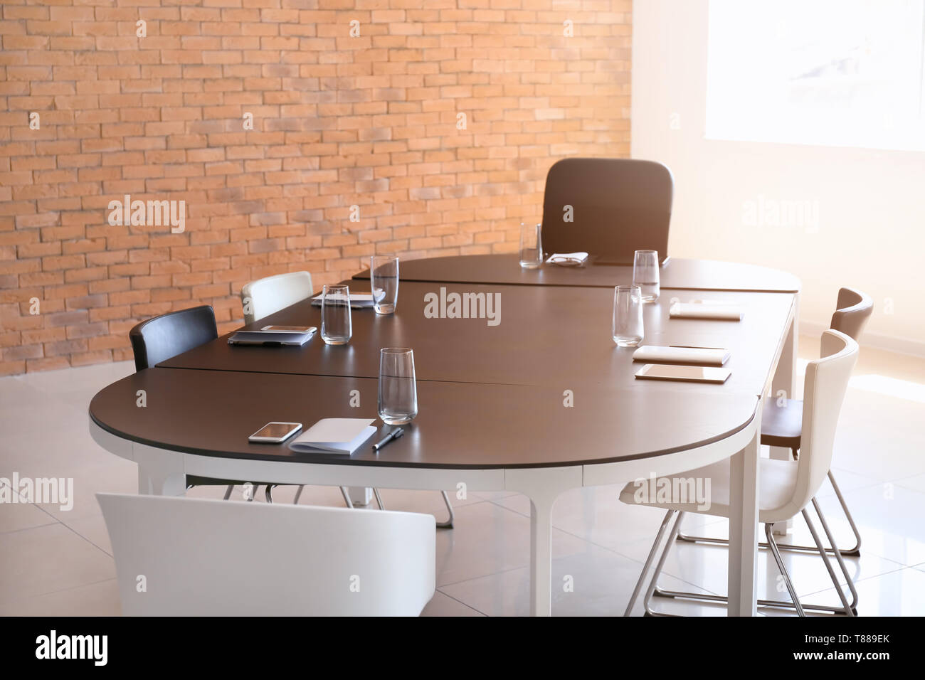 Table prepared for business meeting in conference hall Stock Photo - Alamy