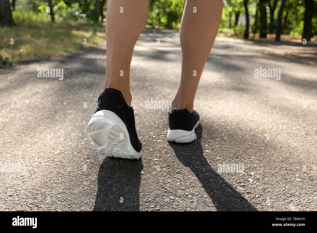 Sporty man running in park Stock Photo - Alamy