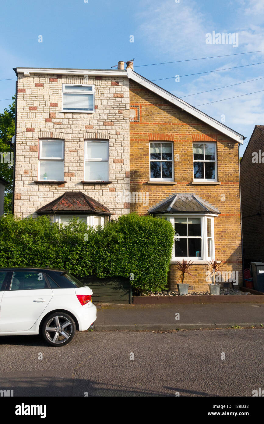 Semi detached houses which are to different architectural tastes; one ...