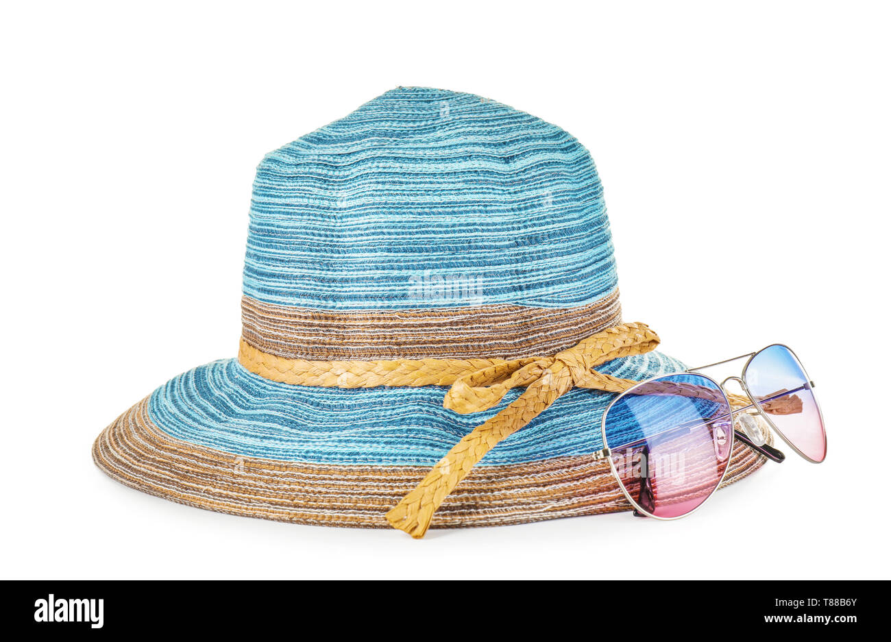Beach hat with sunglasses on white background Stock Photo - Alamy