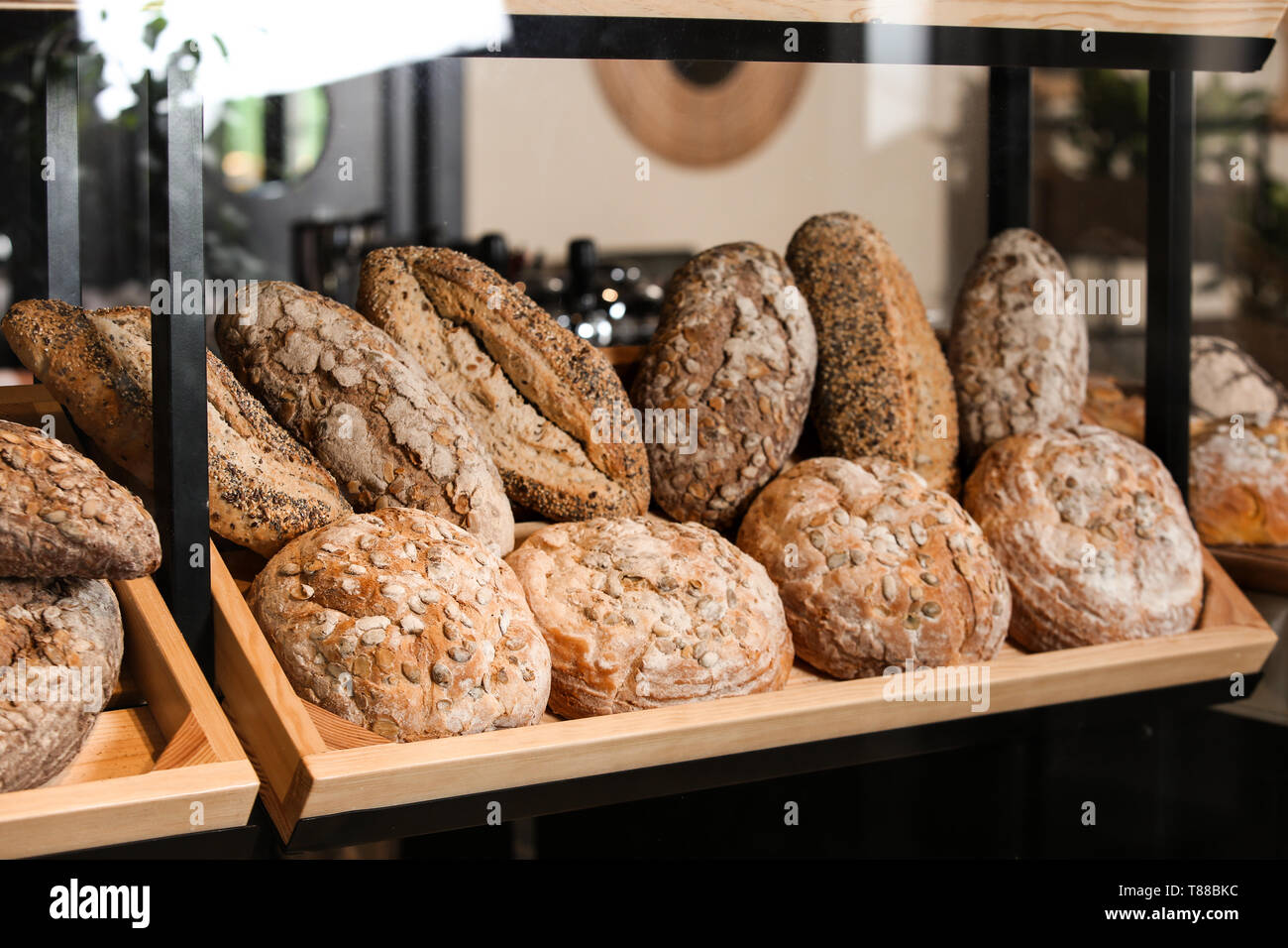 Counter with assorted fresh bread in bakery Stock Photo - Alamy