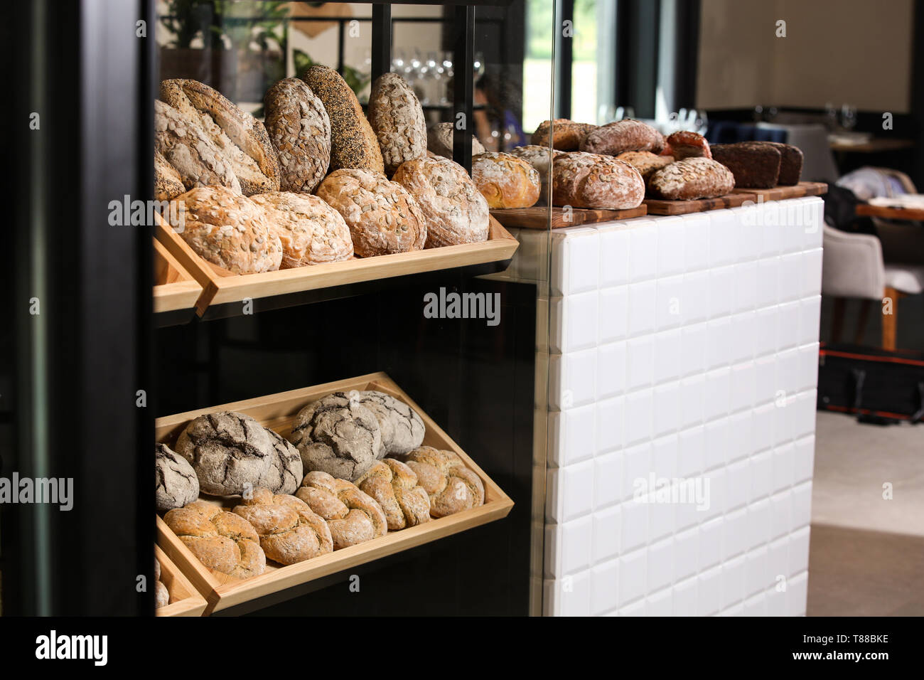 Counter with assorted fresh bread in bakery Stock Photo - Alamy