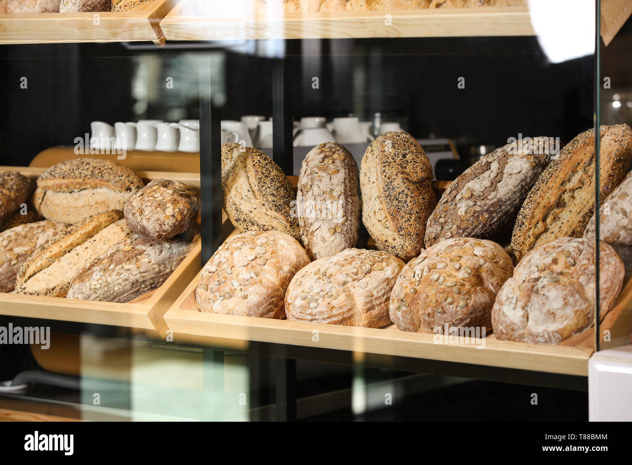Counter with assorted fresh bread in bakery Stock Photo - Alamy