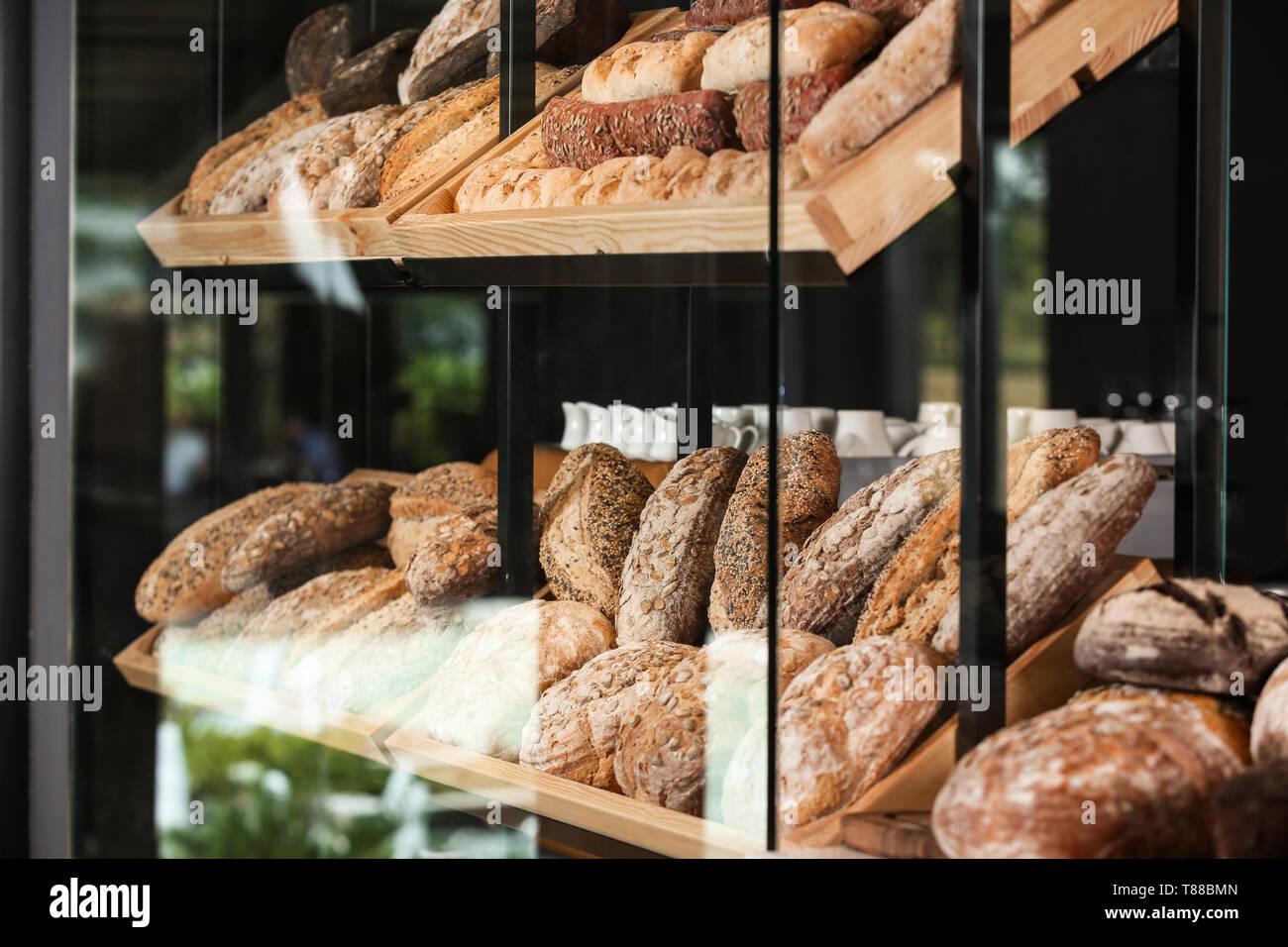 Counter with assorted fresh bread in bakery Stock Photo - Alamy