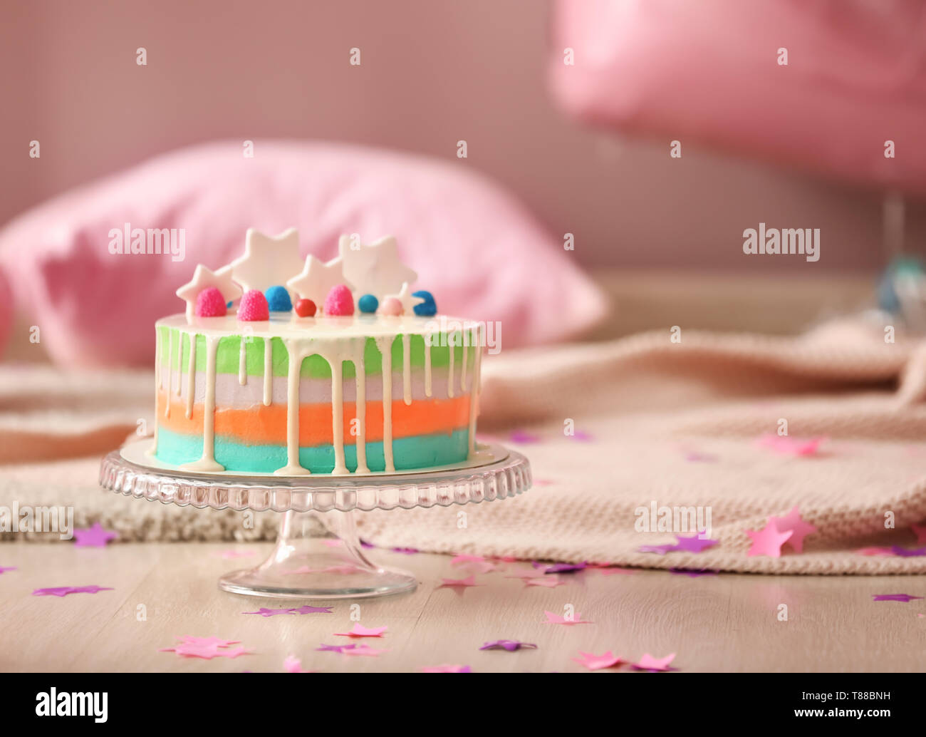 Stand with birthday cake on floor Stock Photo - Alamy