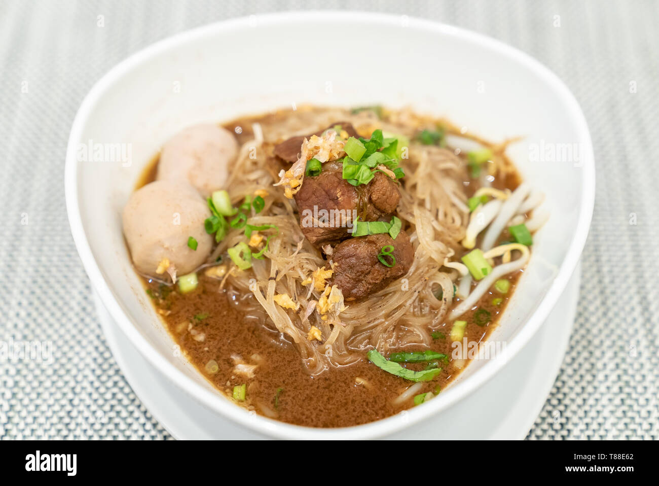 Braised pork rice noodles with meatball Stock Photo - Alamy