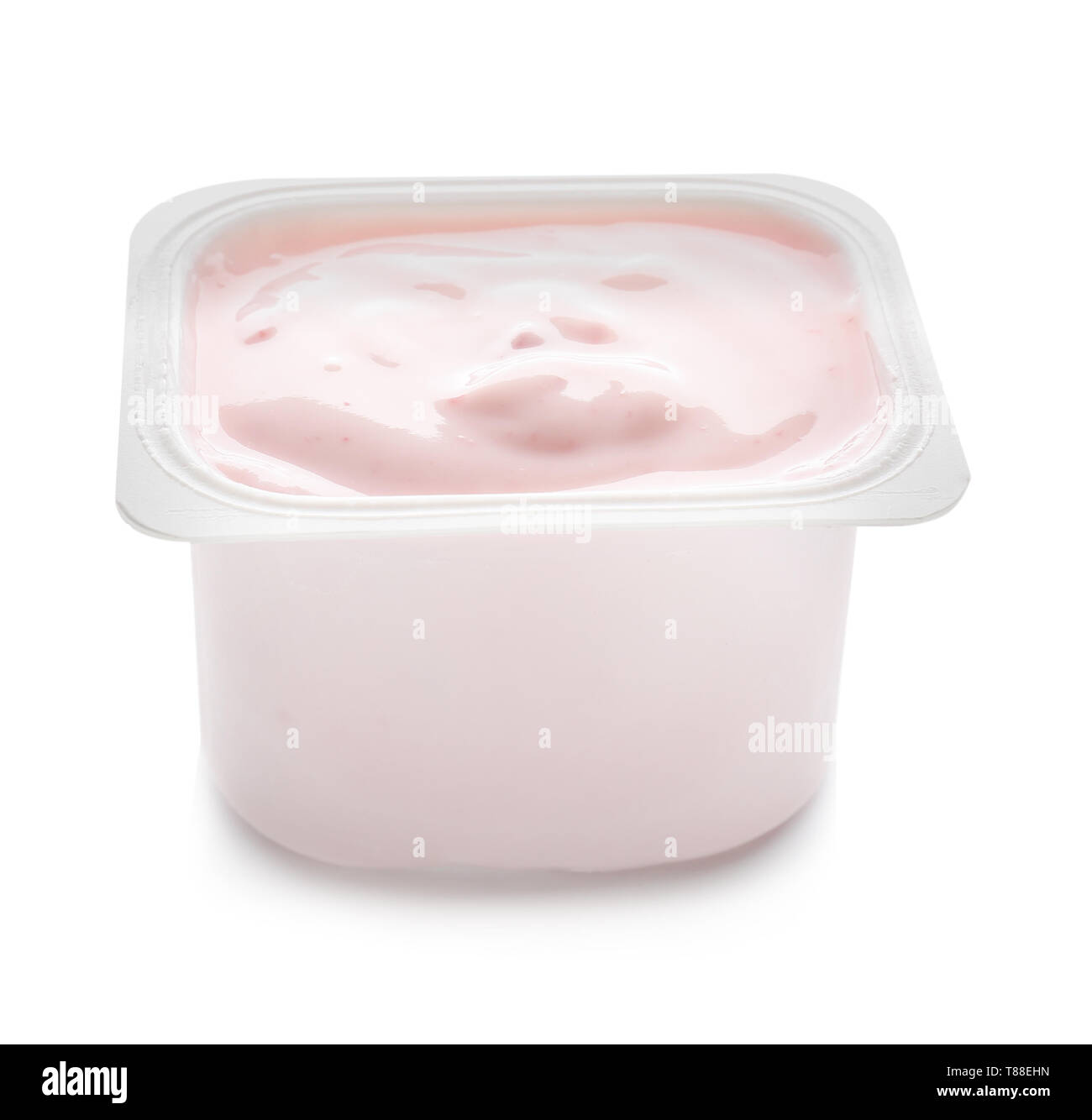 Plastic cup with yummy strawberry yogurt on white background Stock ...
