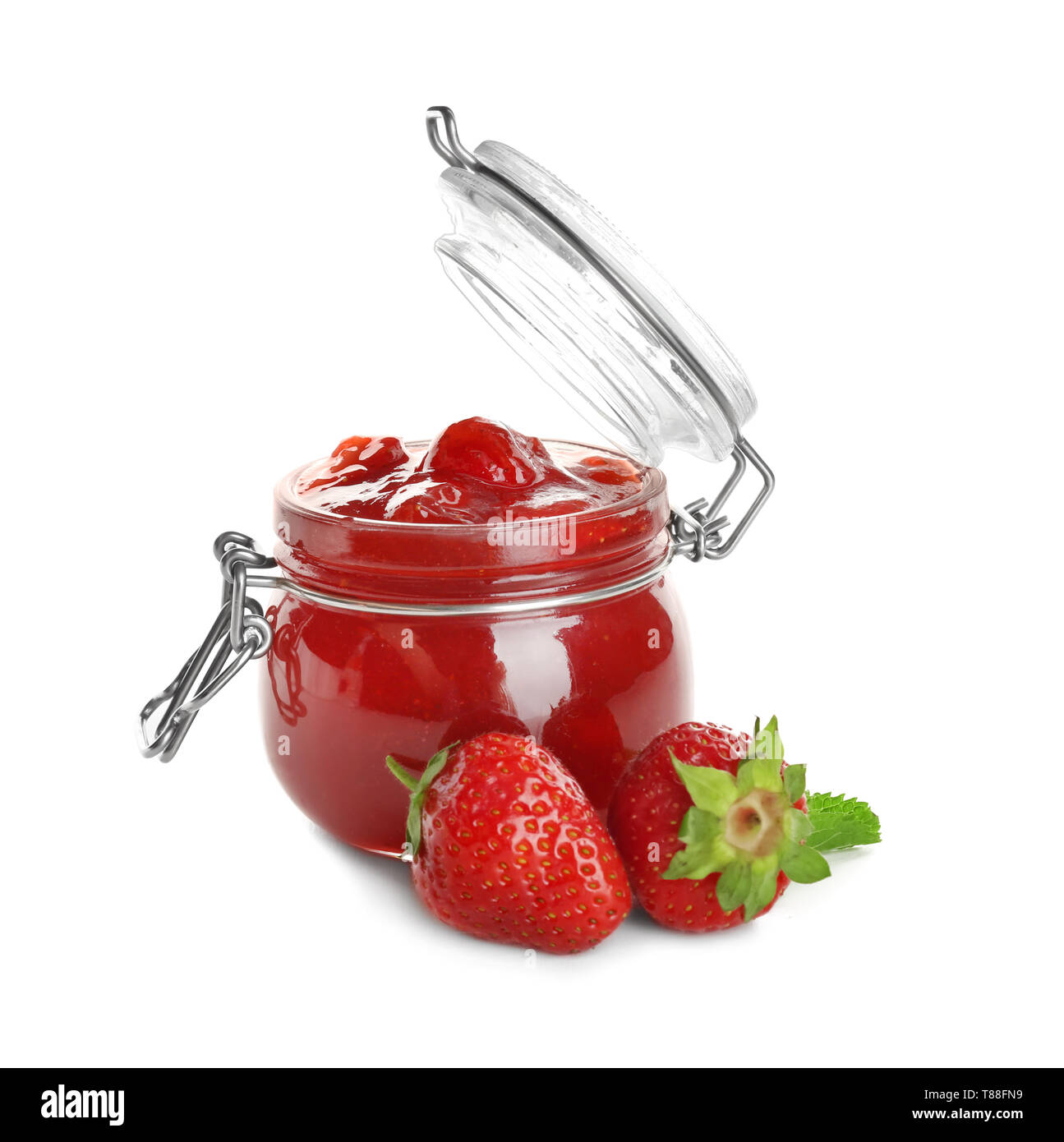 Glass jar with tasty strawberry jam on white background Stock Photo - Alamy