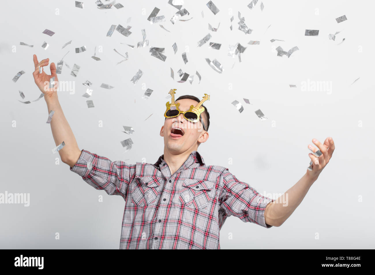 People, holidays and party concept - funny guy in glasses dancing in ...