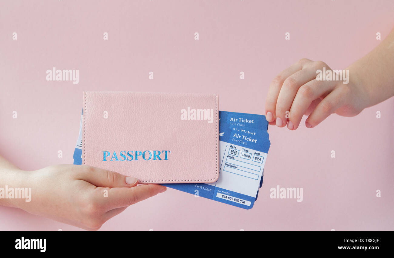 Close up tourist female horizontal hold in hand tickets for plane with ...