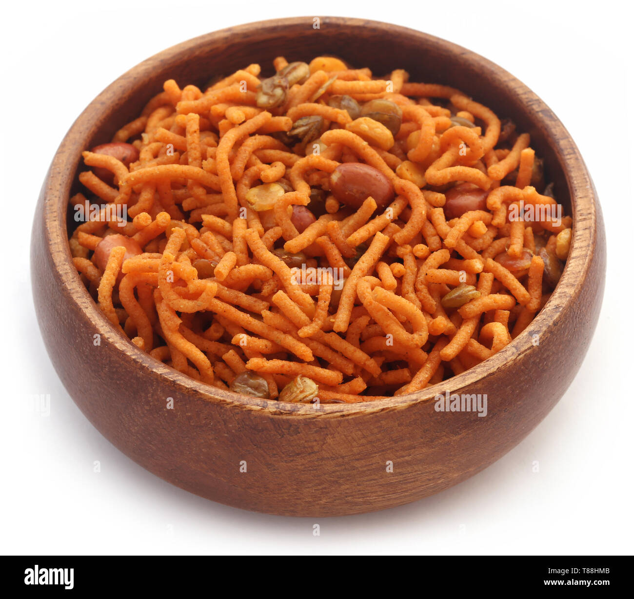 Bombay mix in a wooden bowl over white background Stock Photo - Alamy