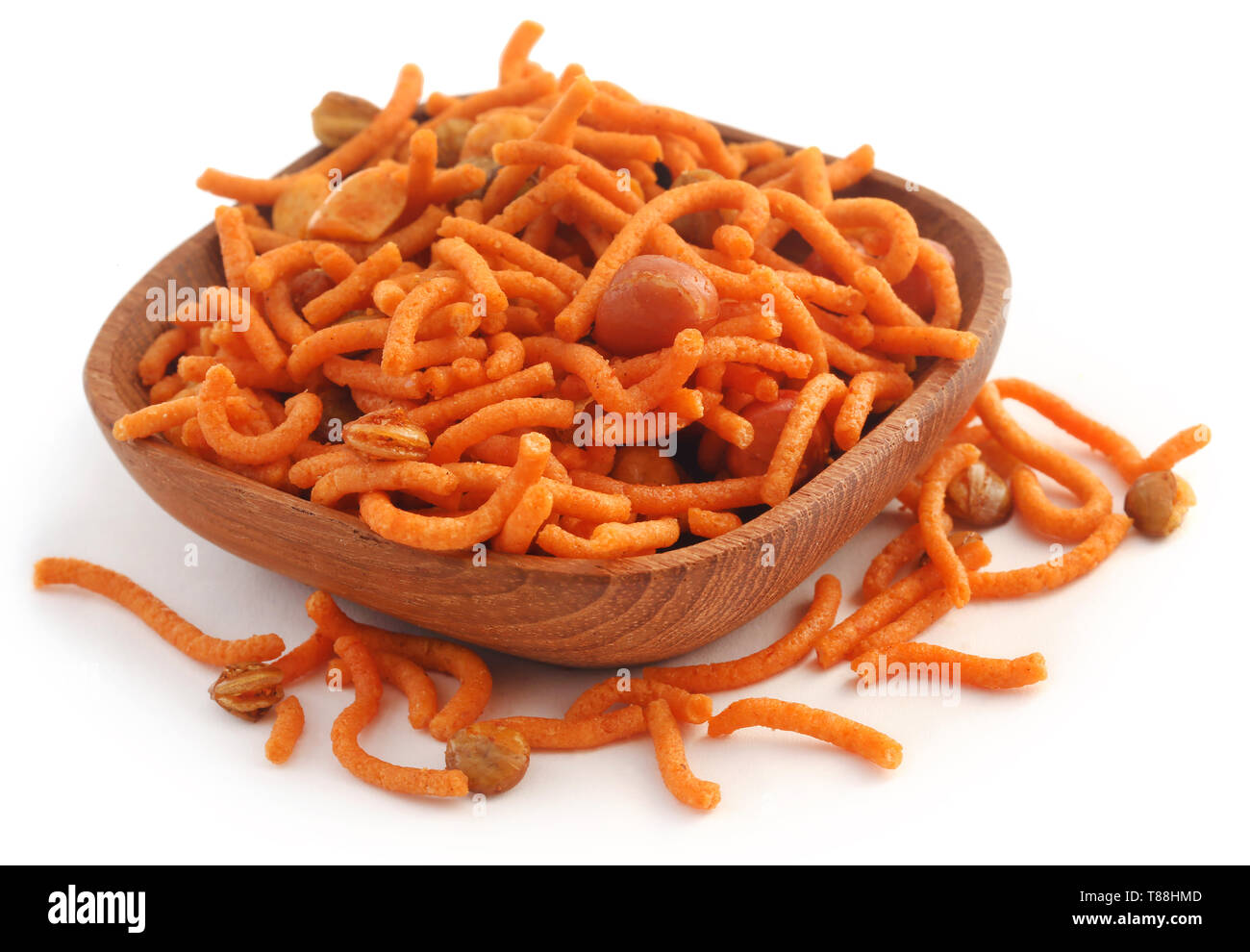 Bombay mix in a wooden bowl over white background Stock Photo - Alamy