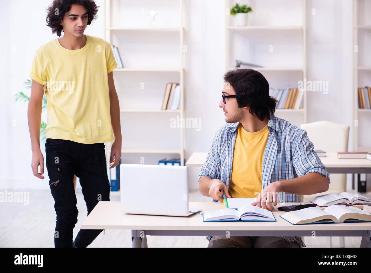 Two male students in the classroom Stock Photo - Alamy
