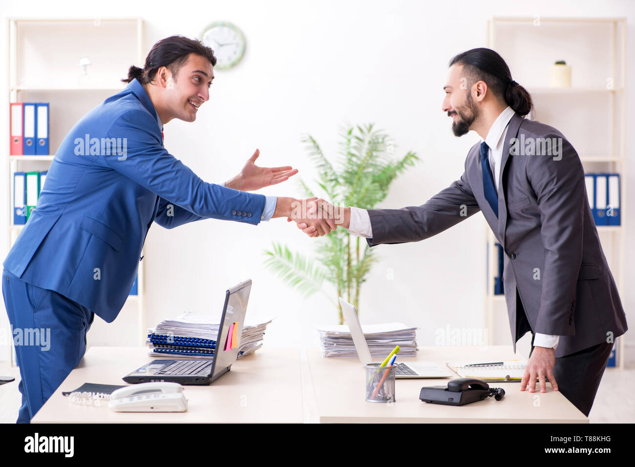 Two male colleagues in the office Stock Photo - Alamy