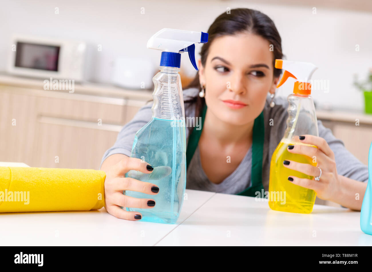 Young female contractor doing housework hi-res stock photography and ...