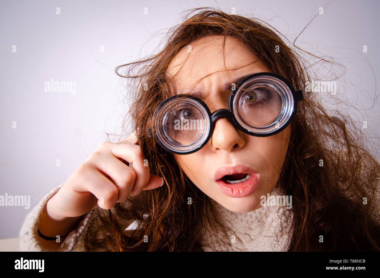 Funny nerd girl working on computer Stock Photo - Alamy