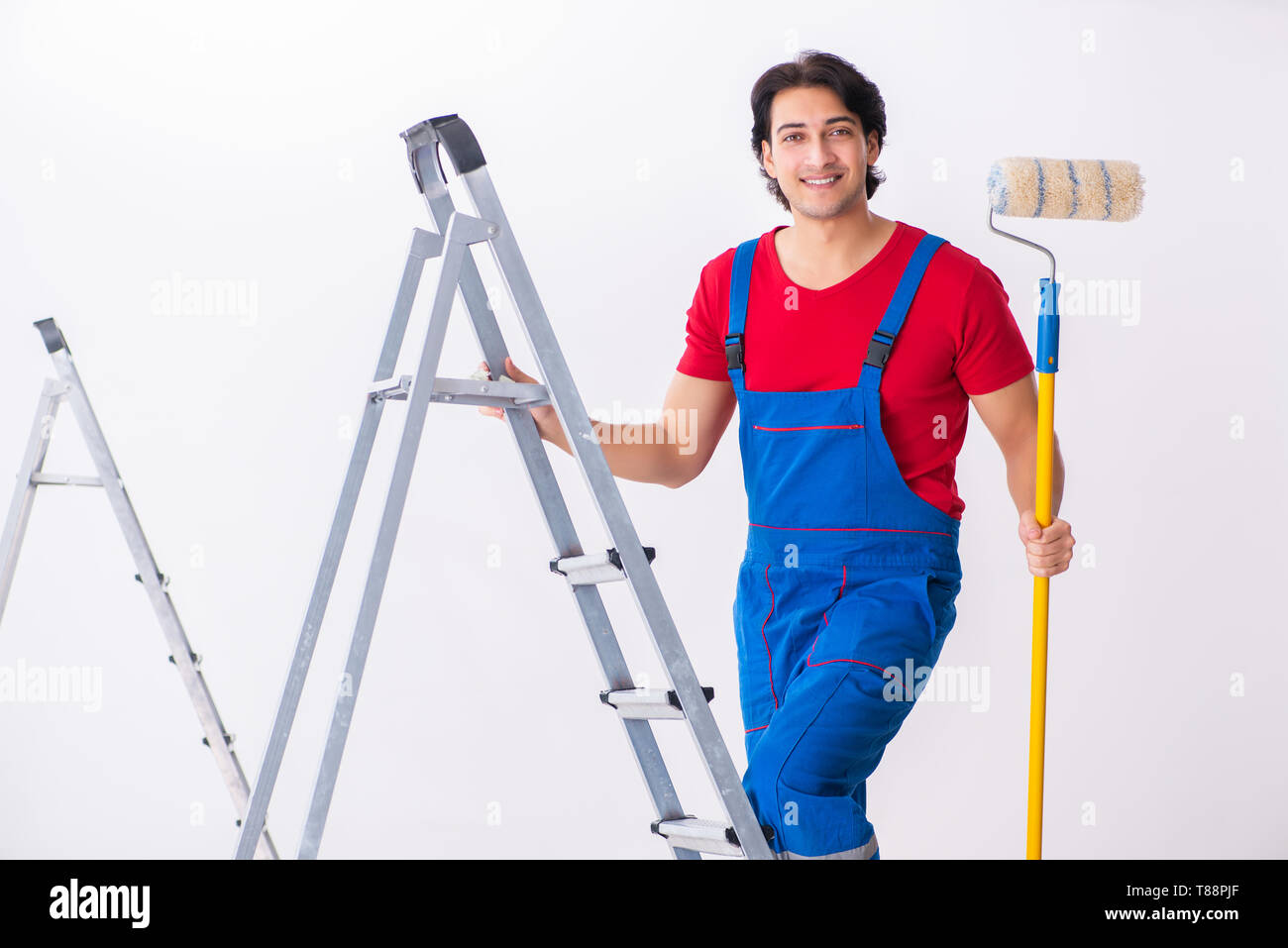 Young handsome contractor working indoors Stock Photo - Alamy