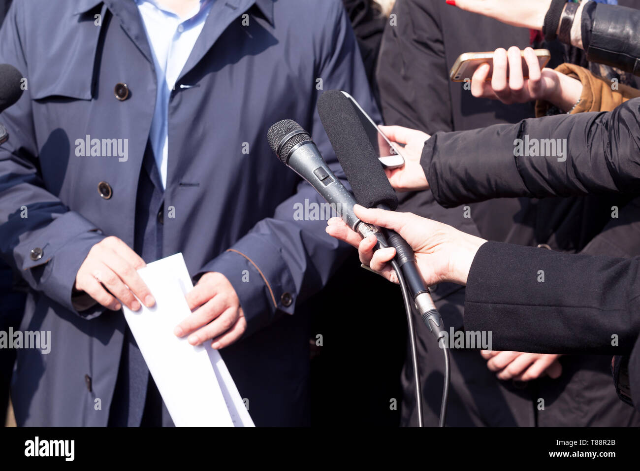 Press interview. Broadcast journalism. Microphone Stock Photo - Alamy