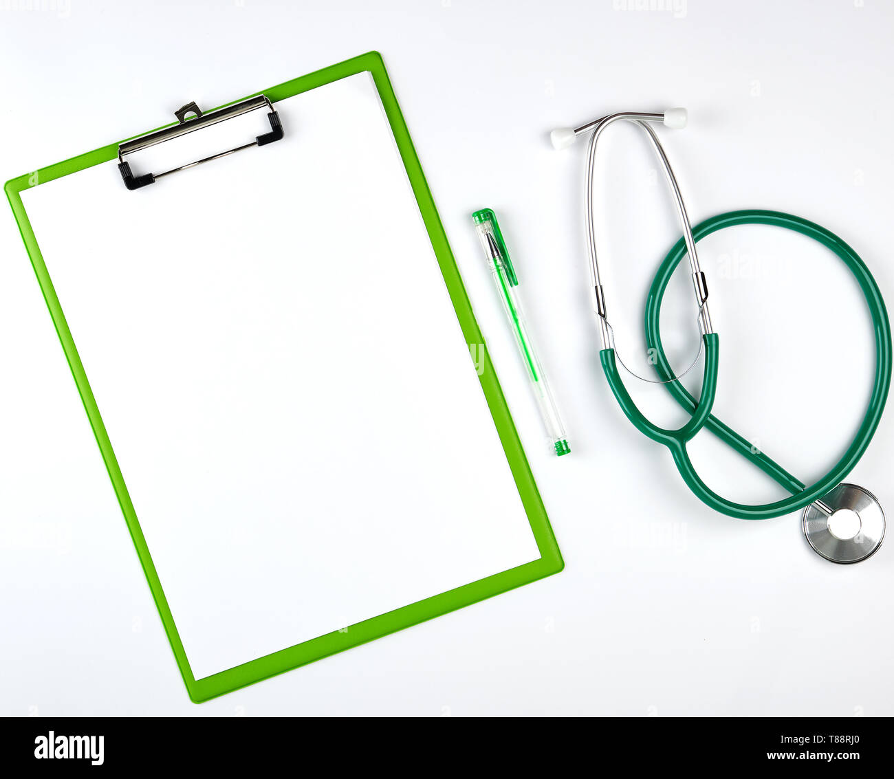 empty white sheets and medical stethoscope on a white background, place ...