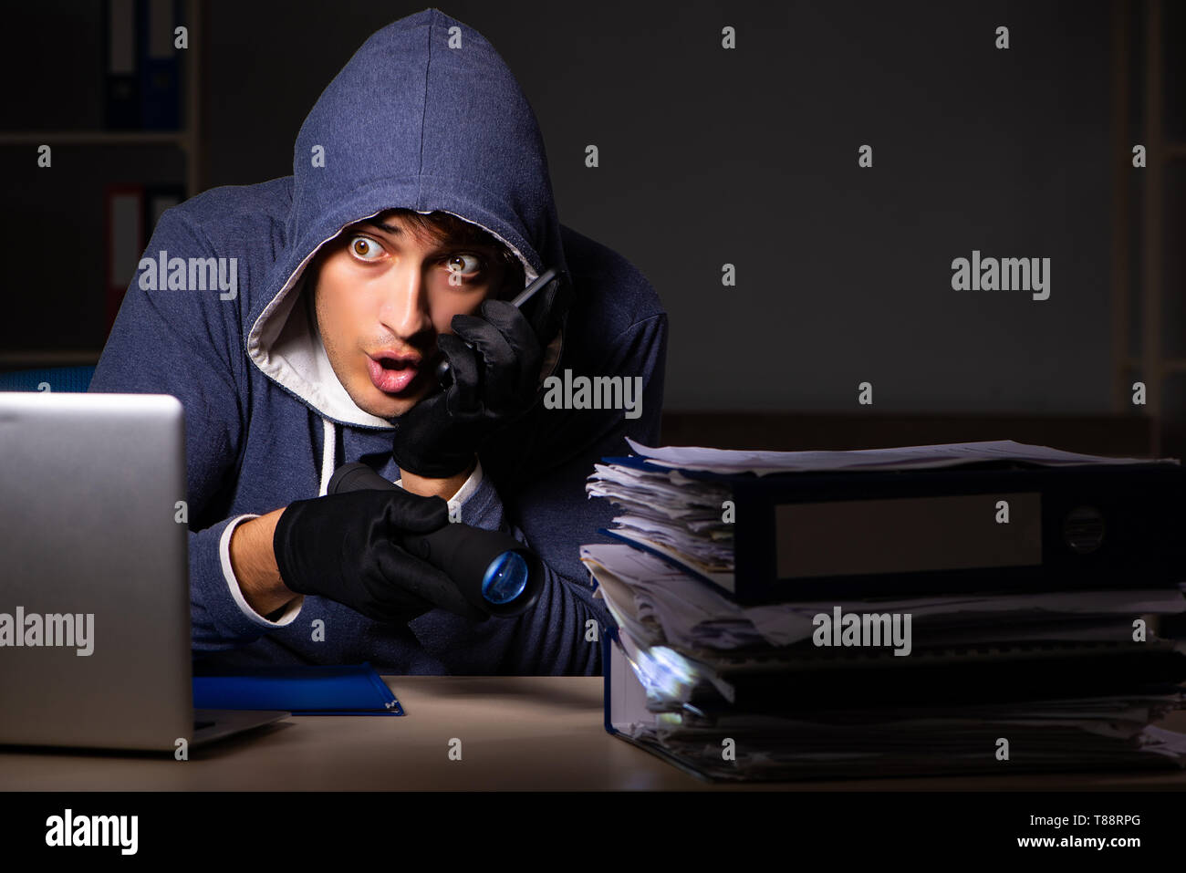 Thief trying to steal personal data in identity theft concept Stock ...