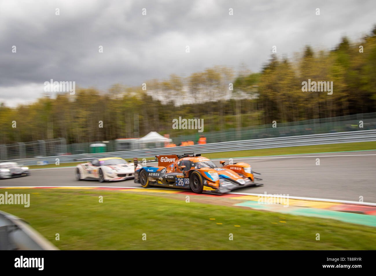 G-Drive Racing LMP2 car followed by a Ferrari into Les Combes, WEC ...