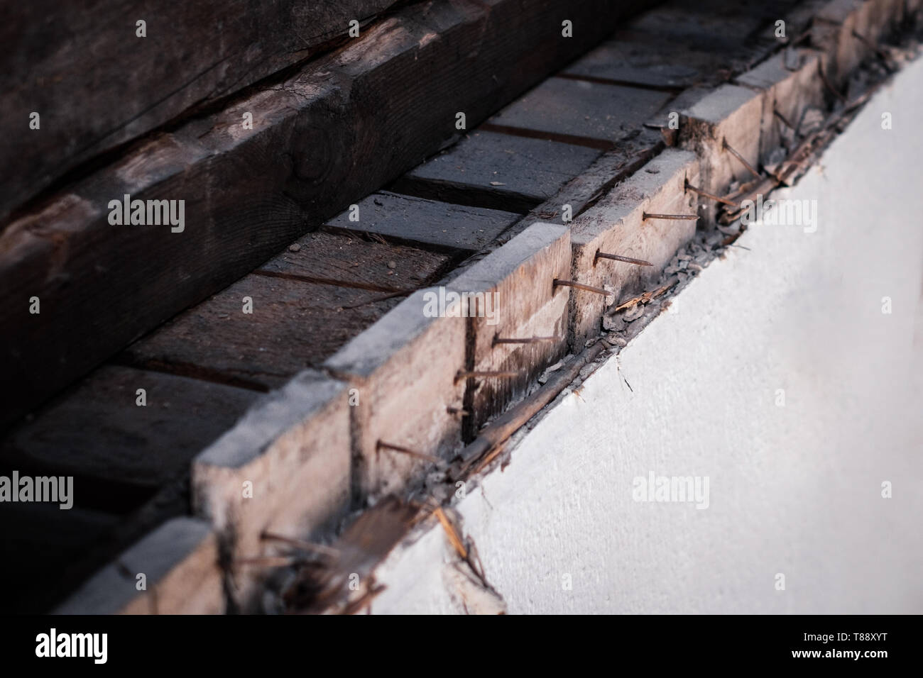 rusty nails in old wooden wall, construction concept Stock Photo - Alamy