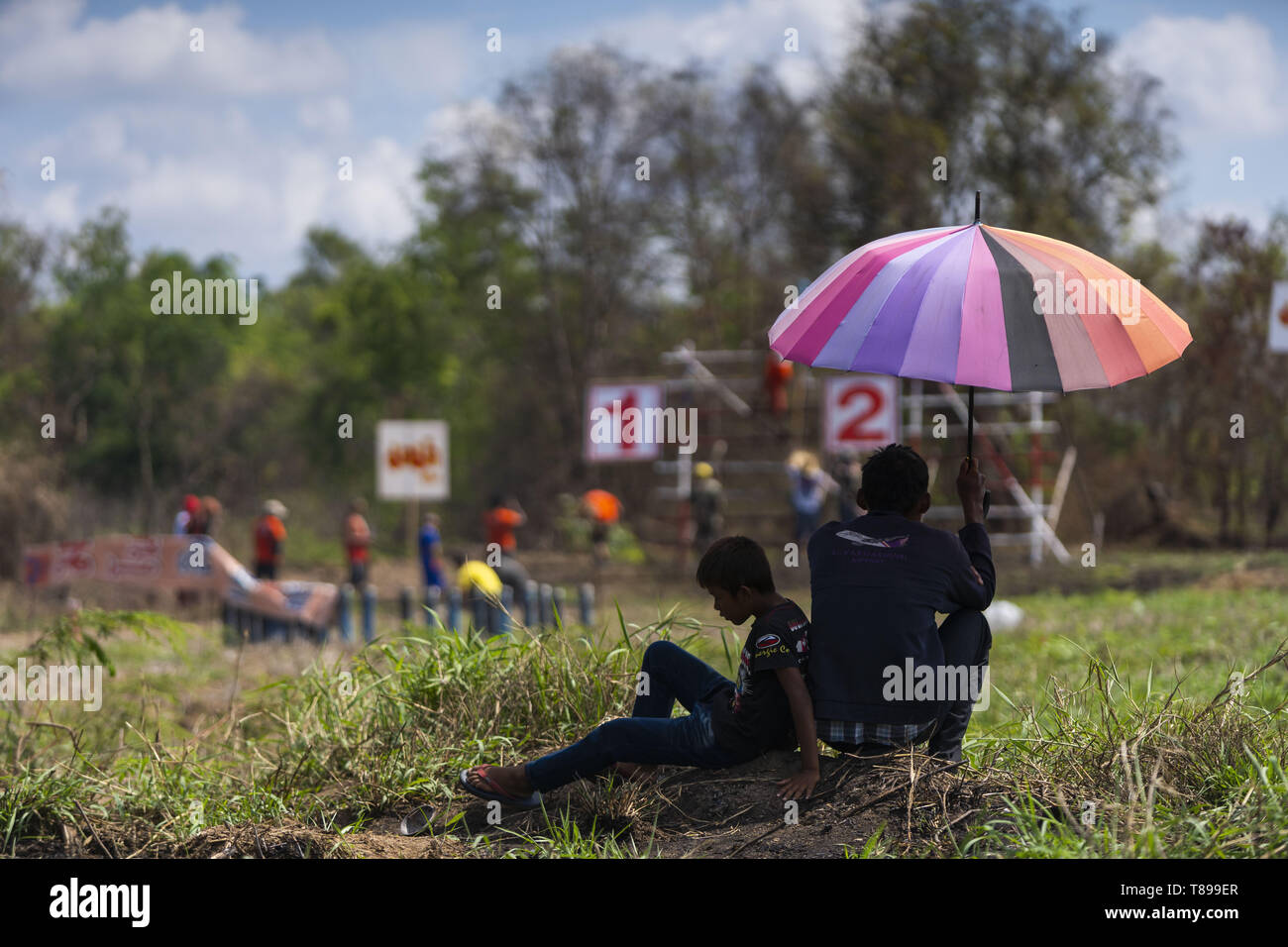 Yasothon, Thailand. 12th May, 2019. Spectators sit awaiting the next ...