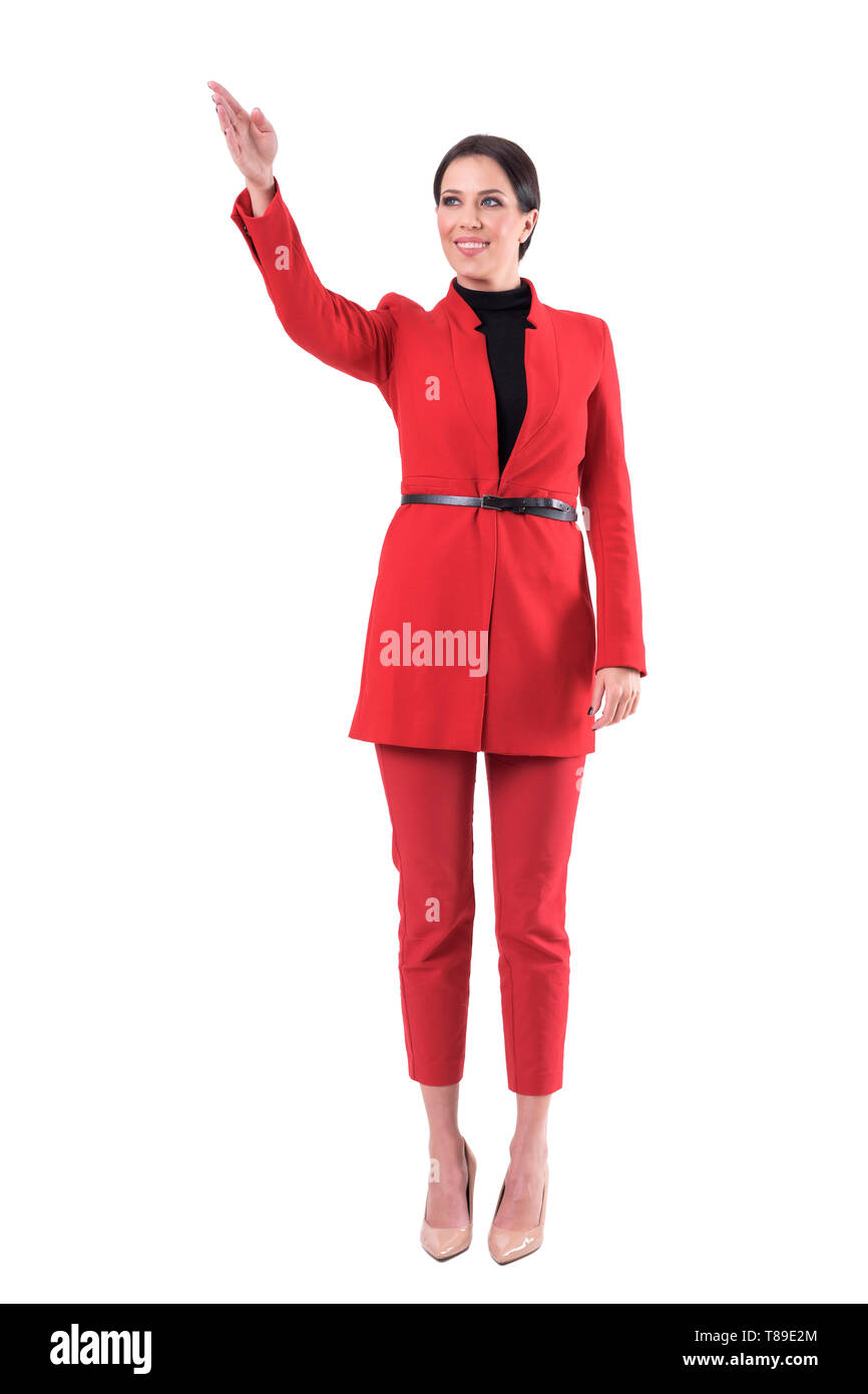 Happy business woman leader in red suit showing the way to success.Full ...