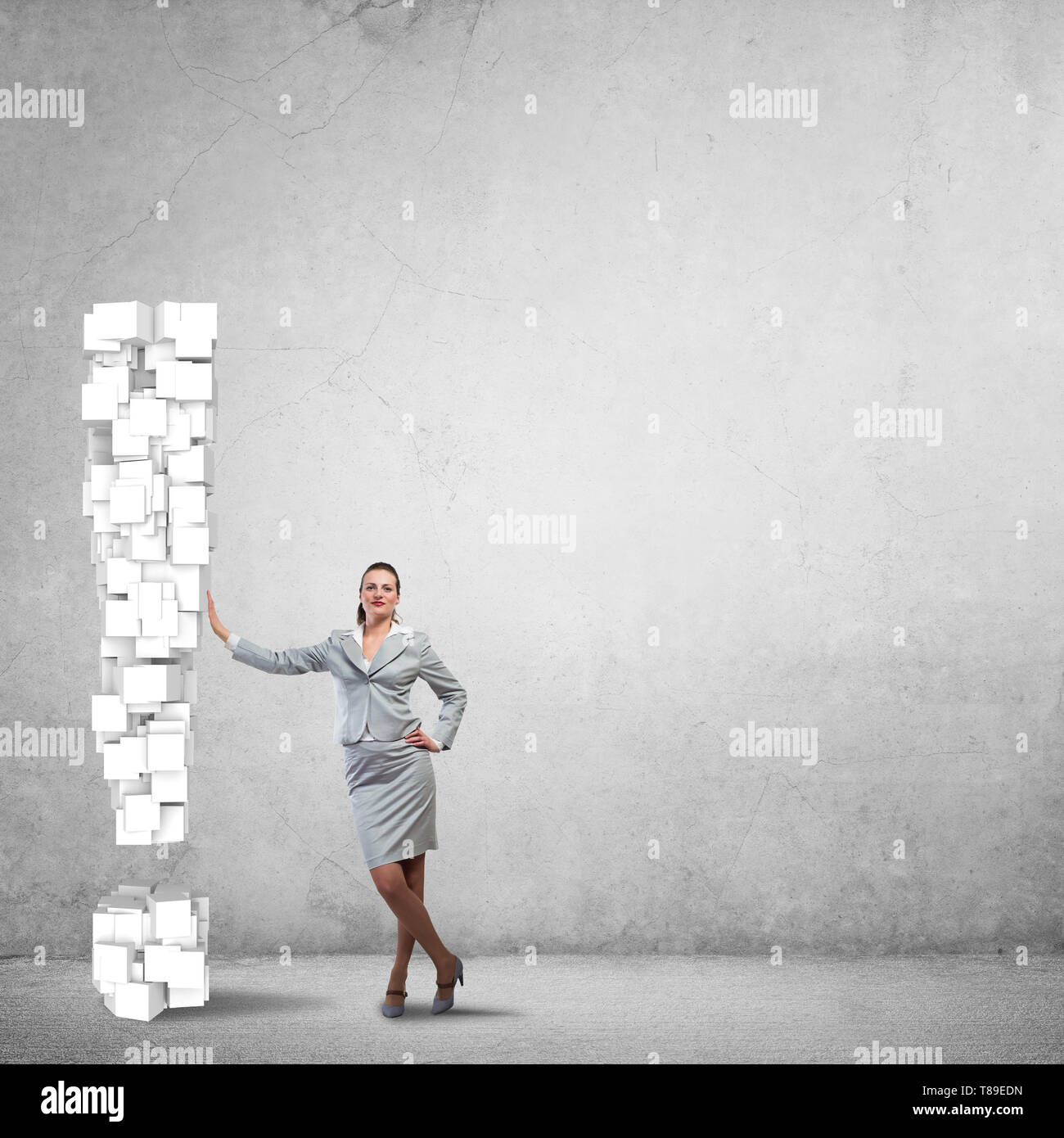 Woman and big attention sign Stock Photo - Alamy
