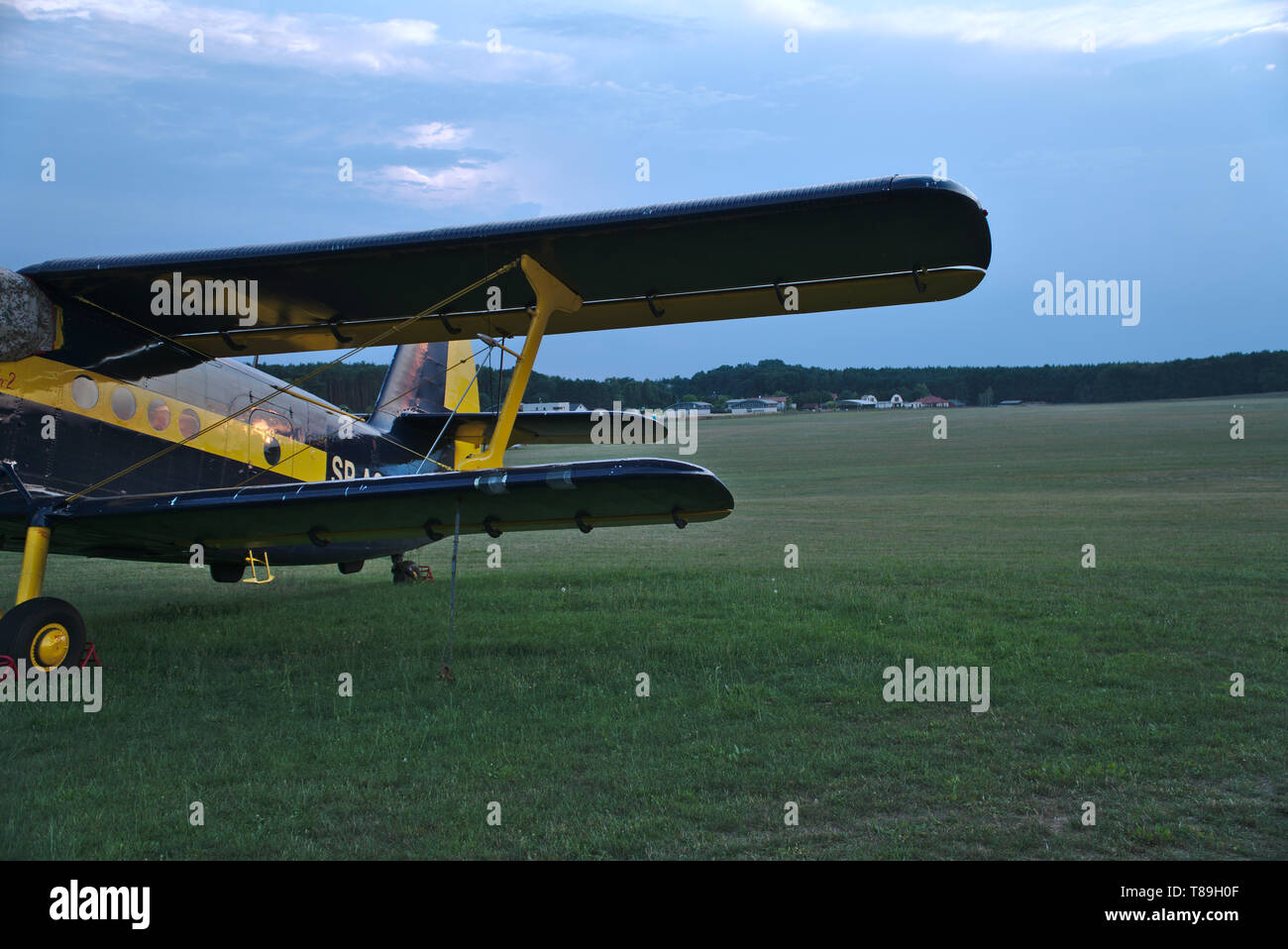Biplane on grass airport Stock Photo - Alamy